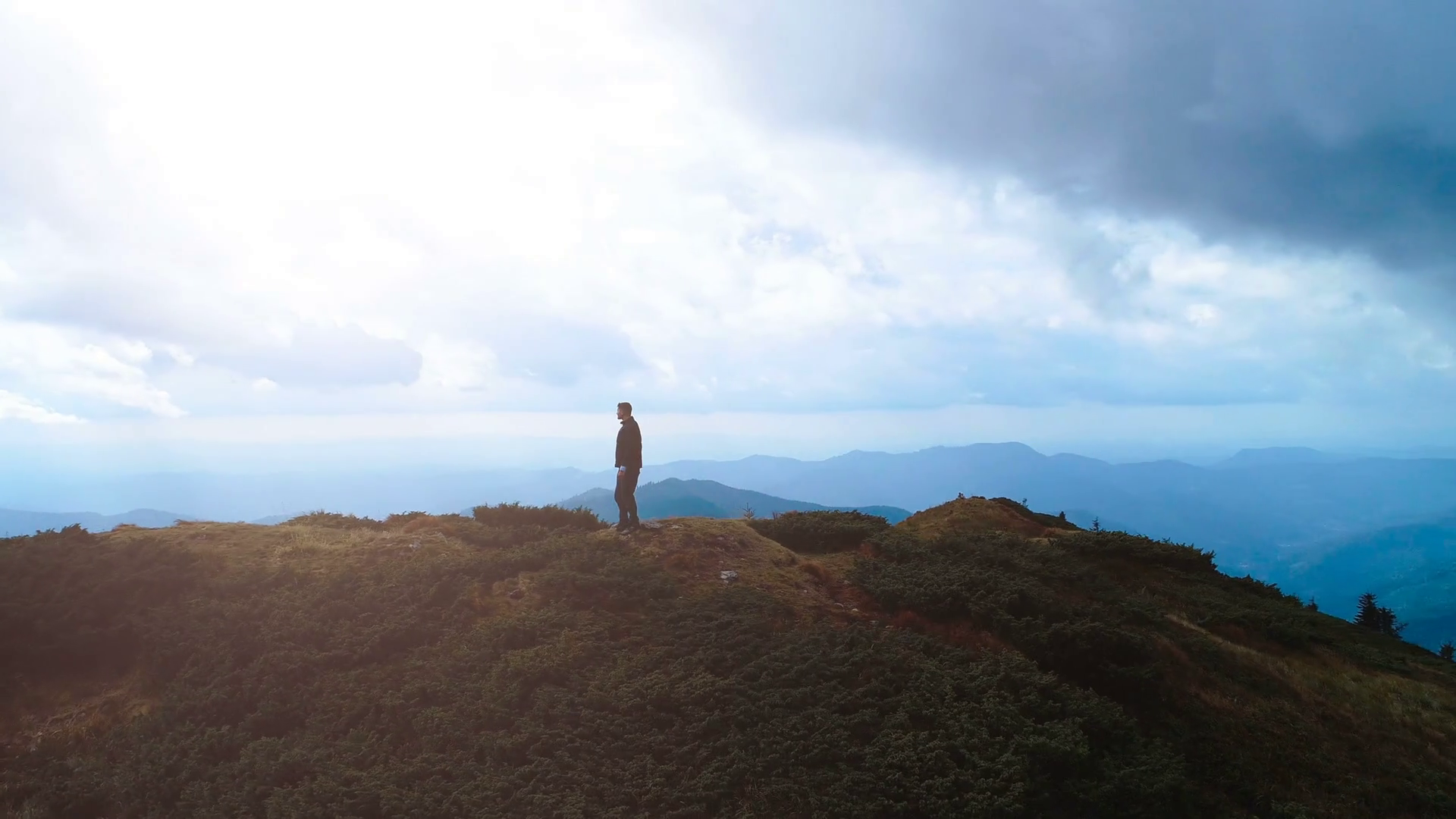 The man standing on the top of the mountain with a beautiful view Stock ...