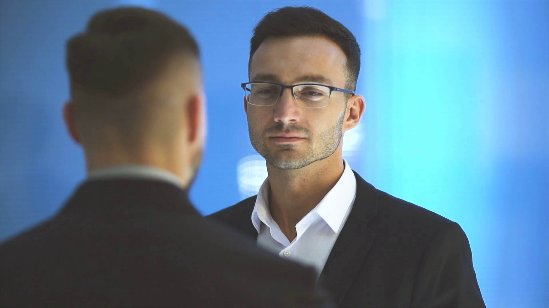 The Two Businessmen Pat Shoulder On Blue Stock Footage SBV-330397629 ...