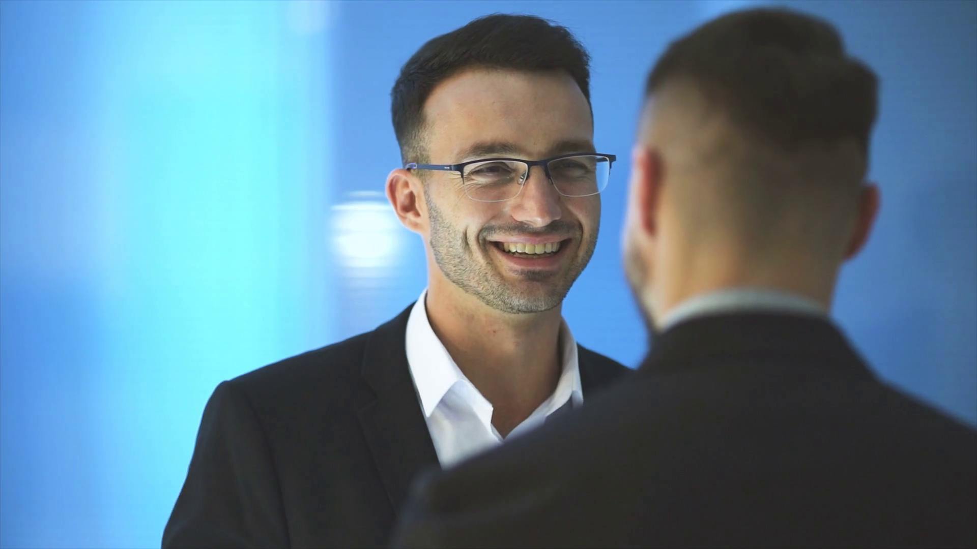 The Two Happy Men Talk On Blue Background Stock Footage SBV-330397742 ...