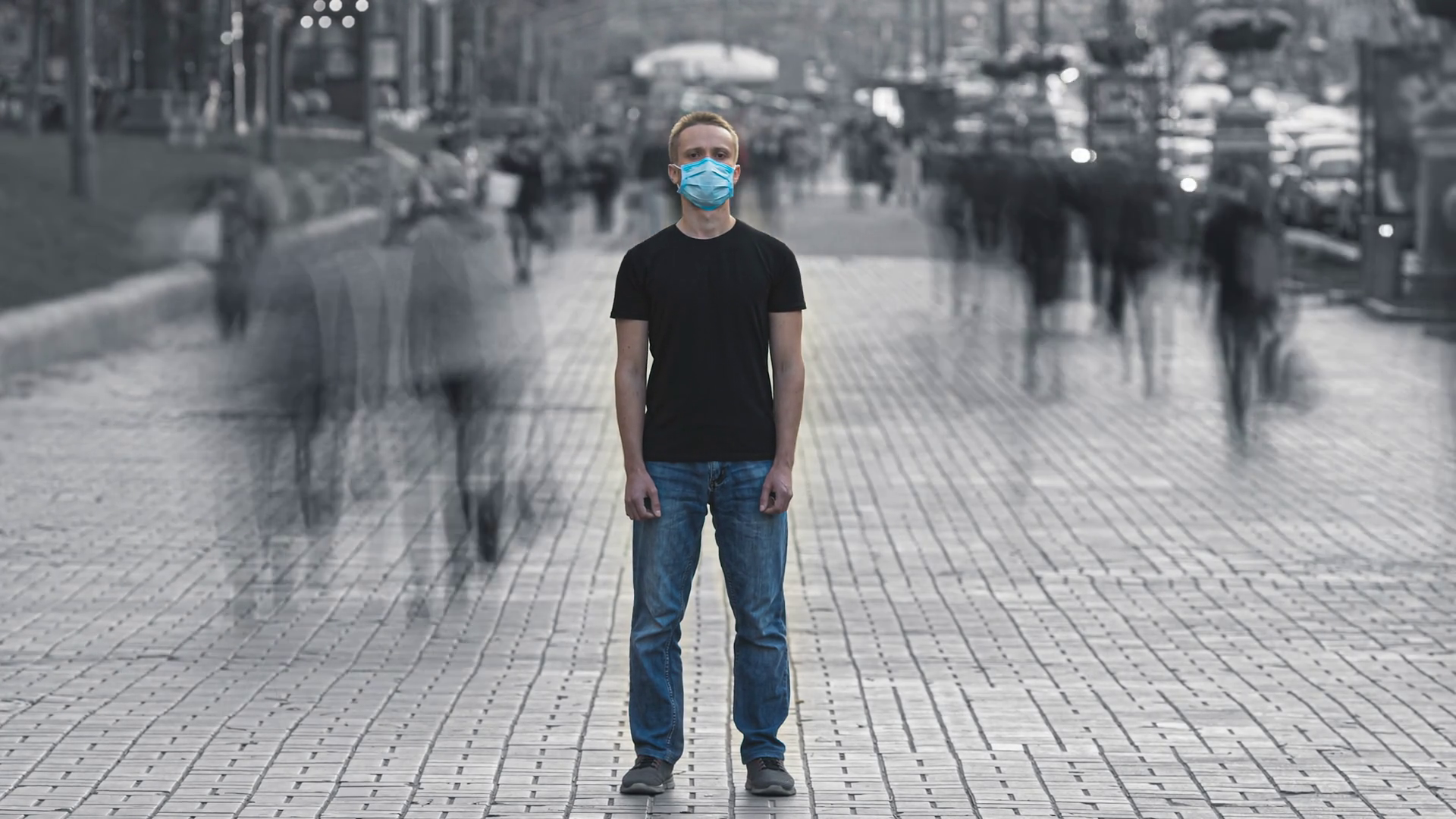 The young man with face mask stands in the crowded street. time lapse ...