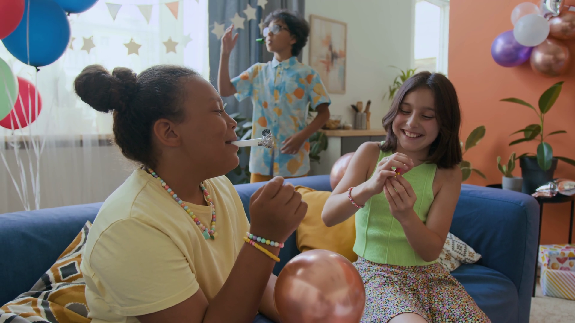 Two Joyful Multi-ethnic Girls Blowing Party Stock Footage SBV-351673993 ...