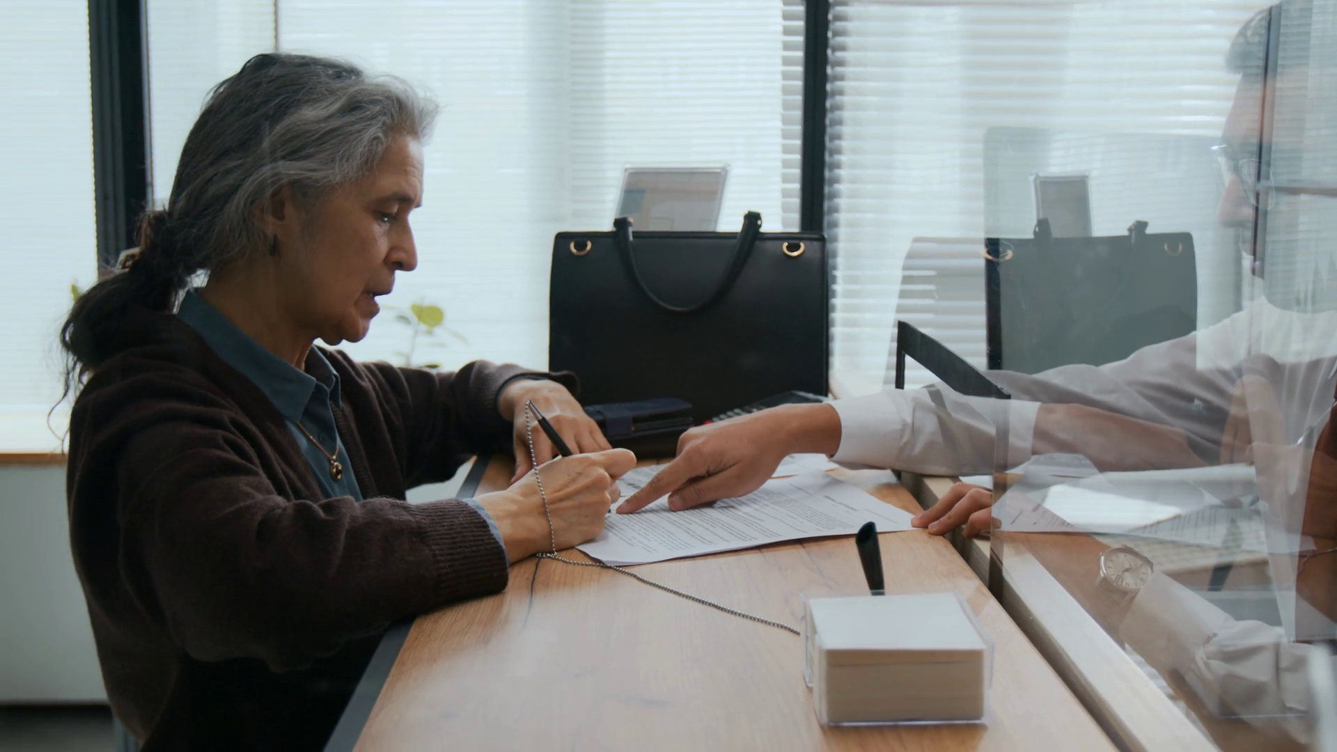 Male Bank Employee Showing Elderly Woman To Stock Footage SBV-352225369 ...