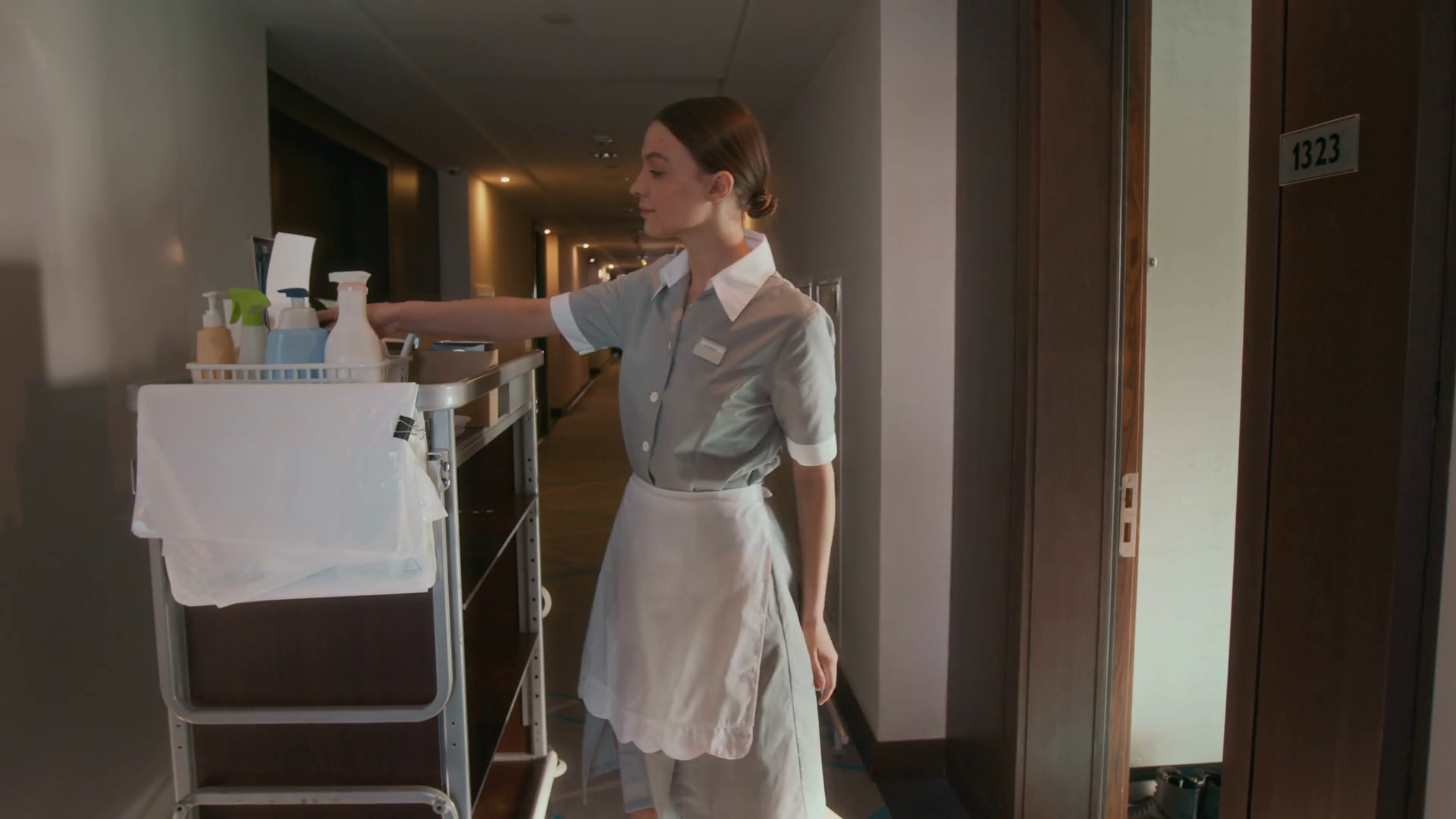 Female Housekeeper In Uniform Opening Door Stock Footage SBV-352020038 ...