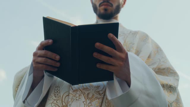 Pastor Reading Scripture Stock Footage: Royalty-Free Video Clips ...