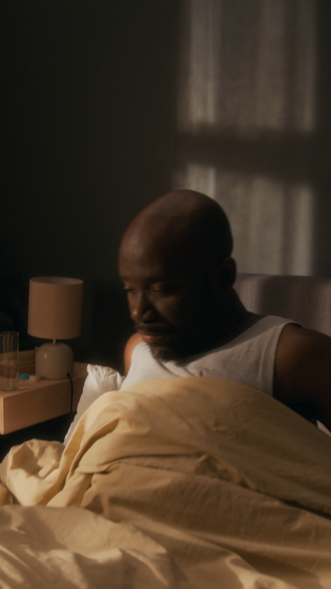 Vertical Shot Of Black Man Waking Up Feeling Stock Footage SBV ...