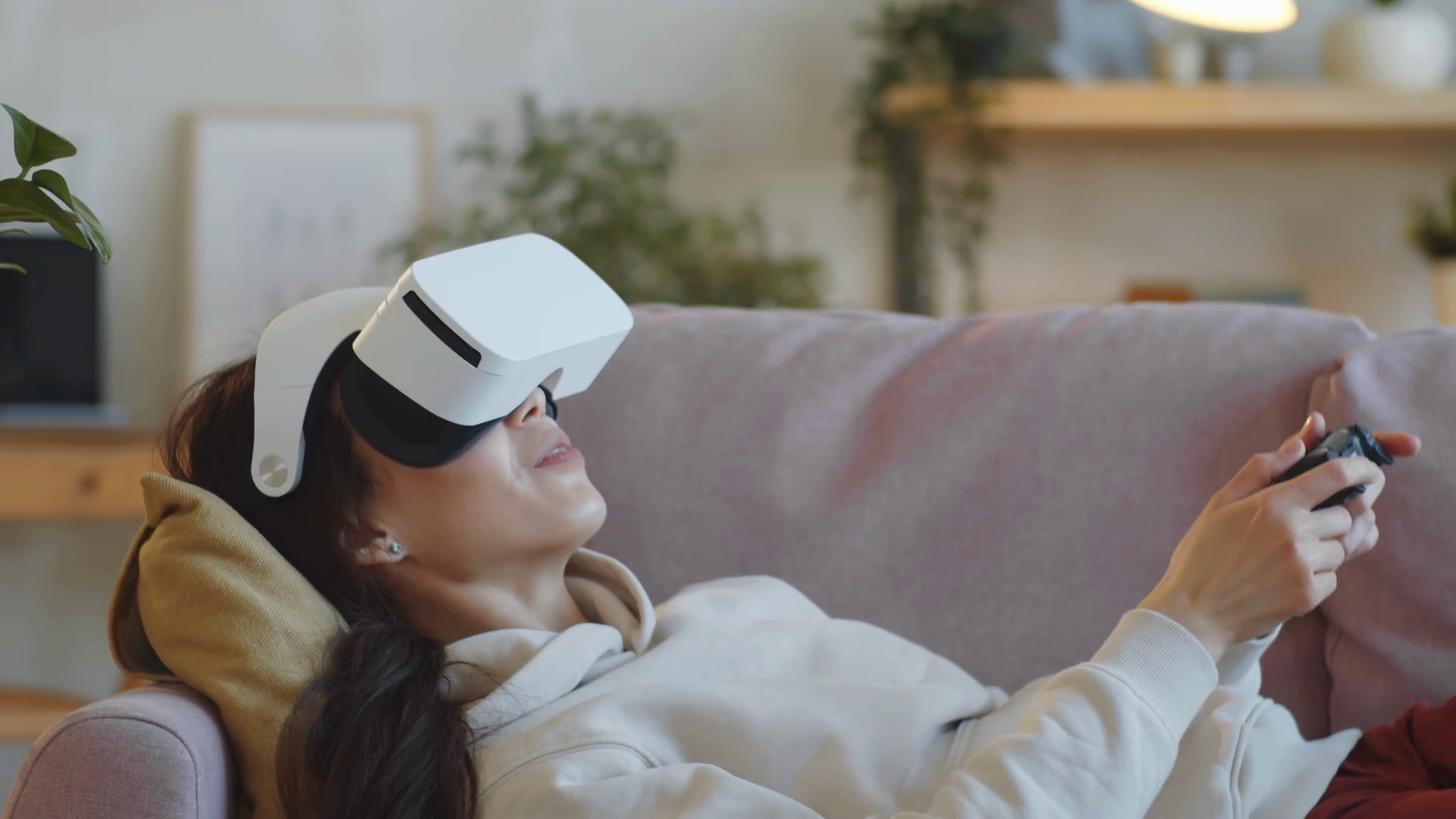 Young Woman In Vr Headset Lying On Sofa At Stock Footage SBV-346797734 ...