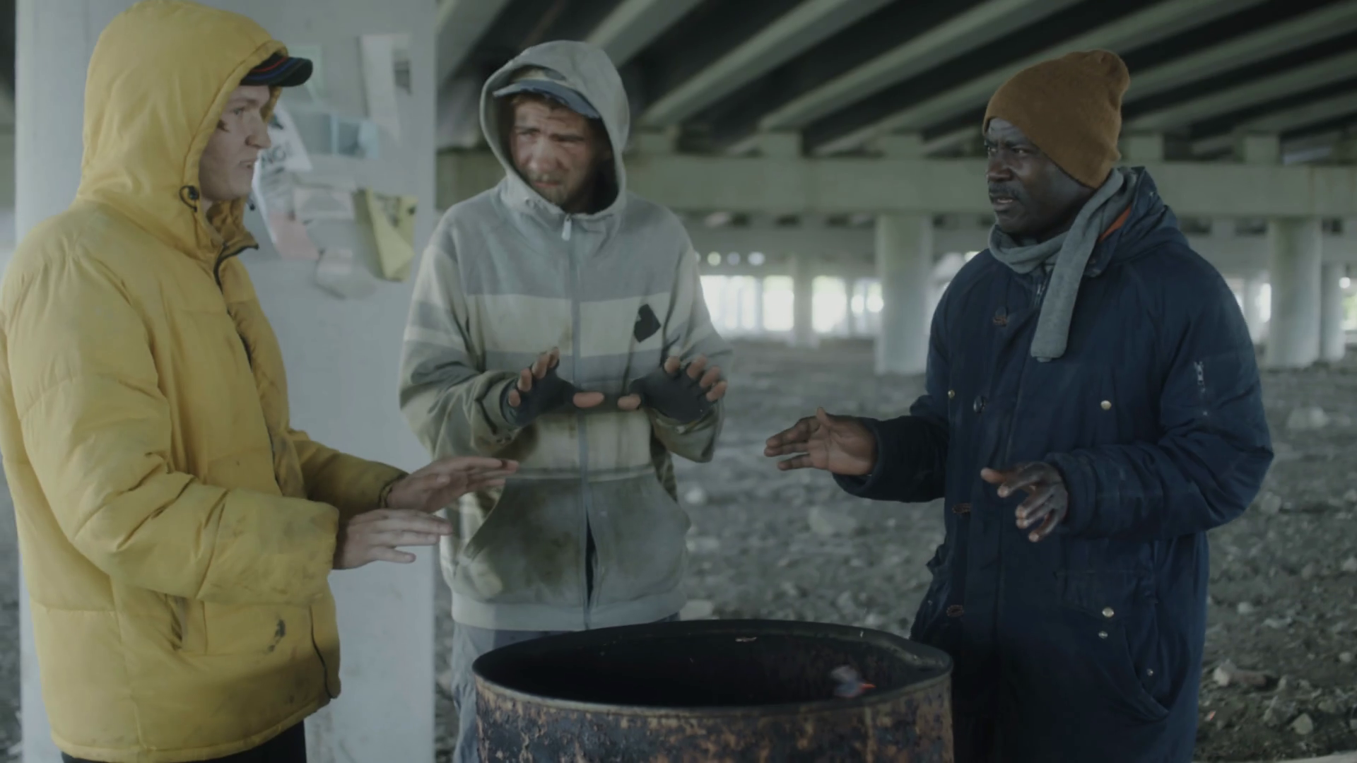 Three Multiethnic Homeless Men Warming Hands Stock Footage SBV ...
