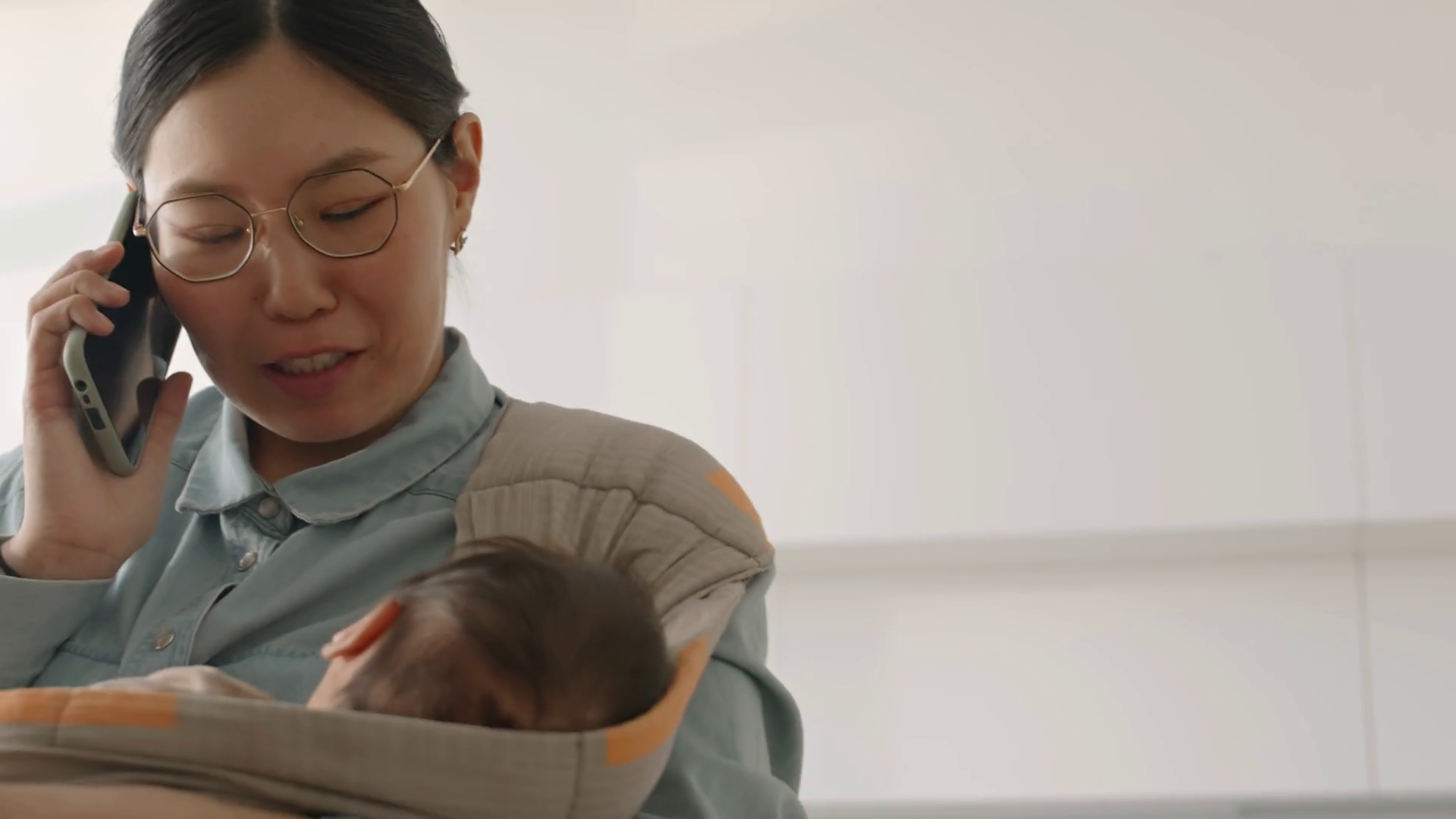 Waist Up Of Asian Mom With Baby Son In Sling Stock Footage SBV ...