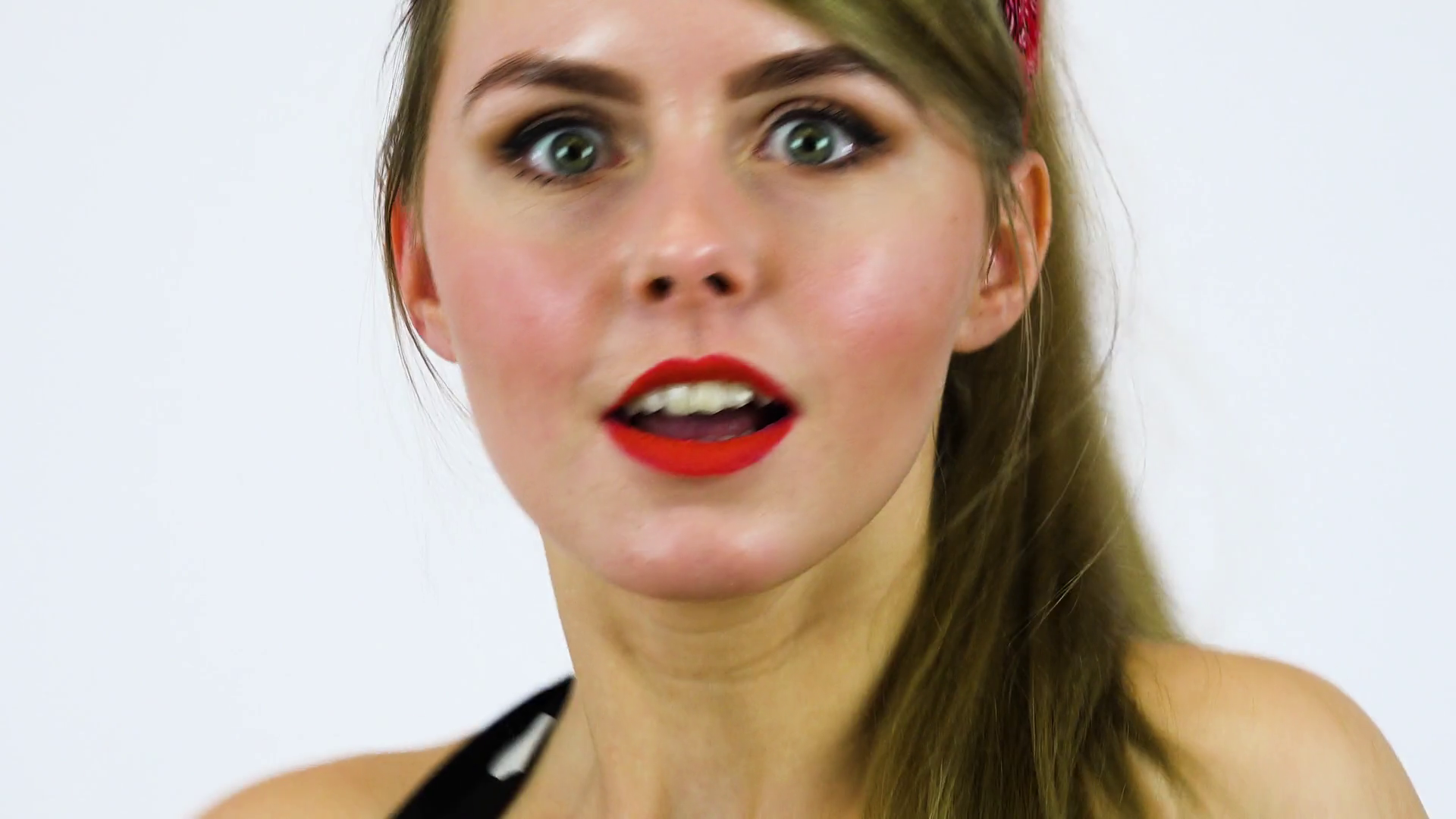 A beautiful 50s pin-up girl with a surprised expression - face closeup ...