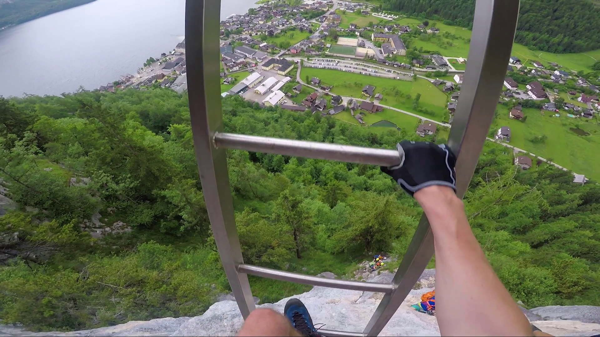 POV - a man climbs up a ladder to a rope at a cliff Stock Video Footage ...