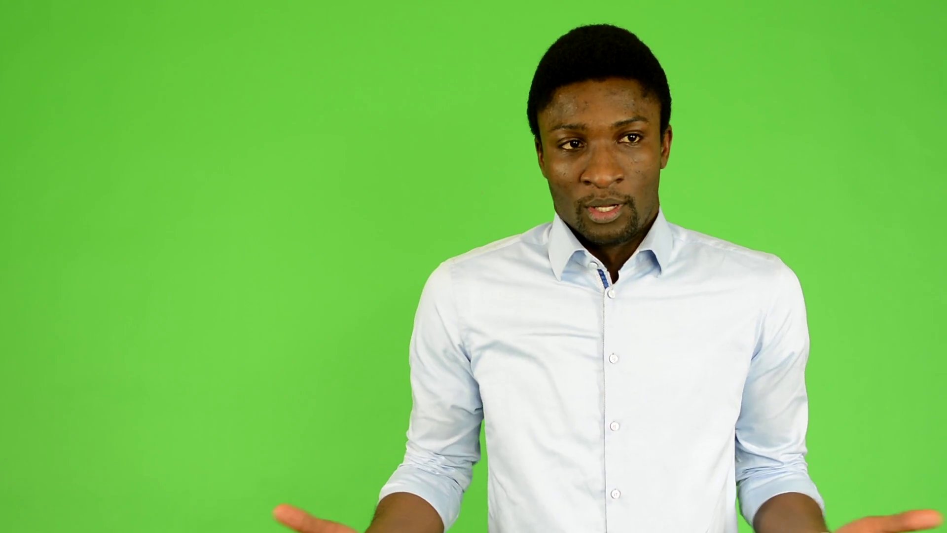 young handsome black man do not understand - green screen - studio ...