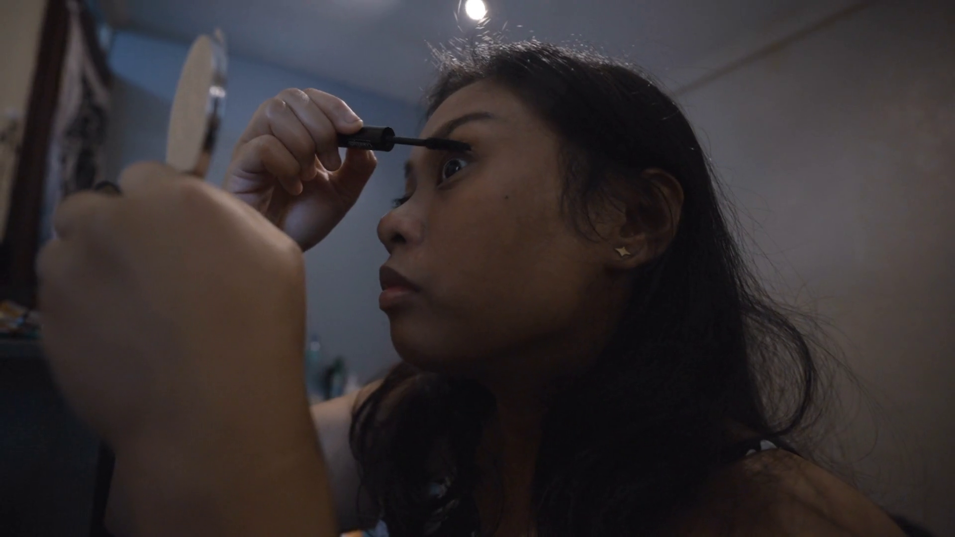Calm Non-binary Filipino Doing Make Up Stock Footage SBV-346841676 ...