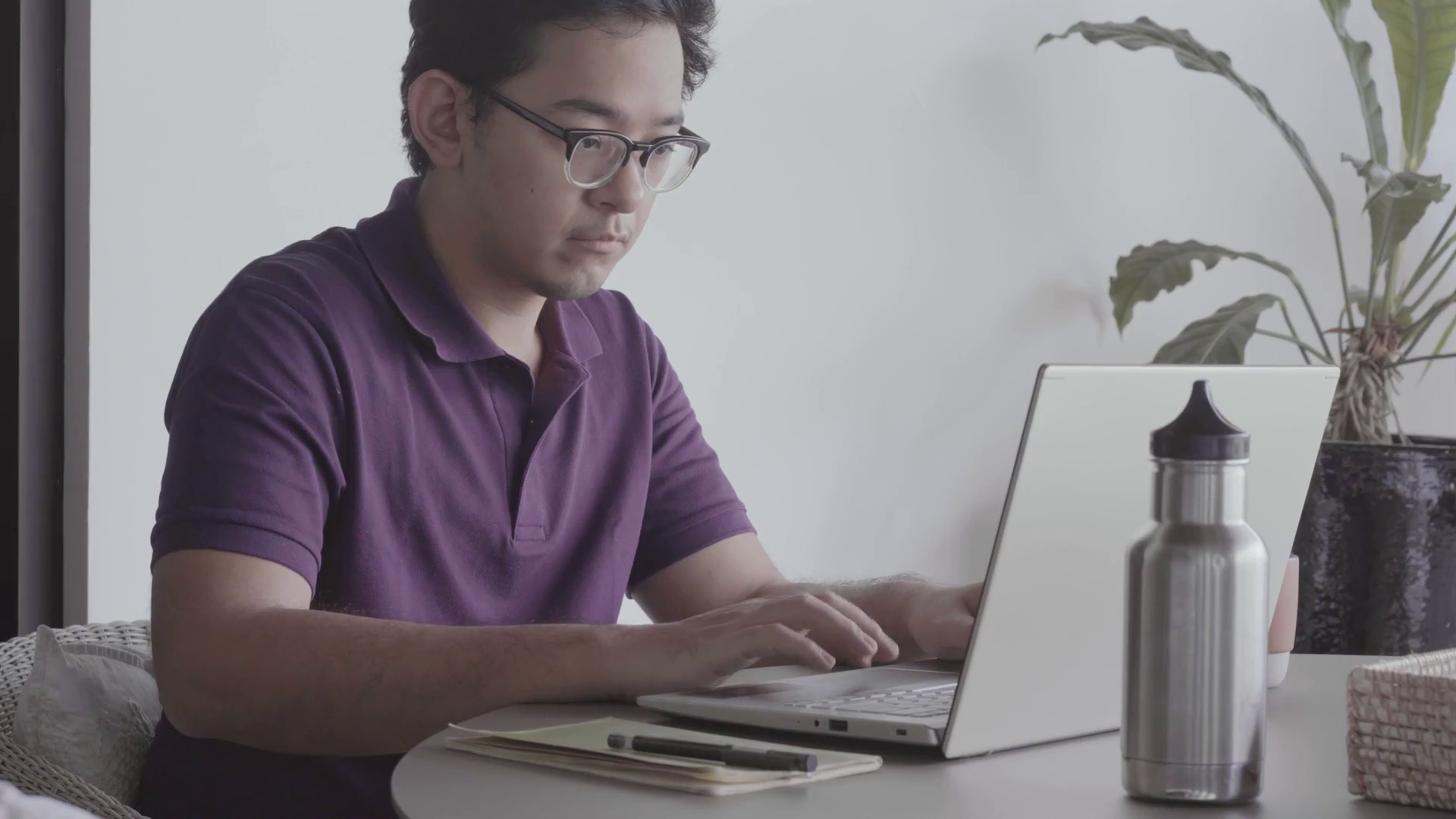 Calm Filipino man working, writing at home outdoors at veranda Stock ...