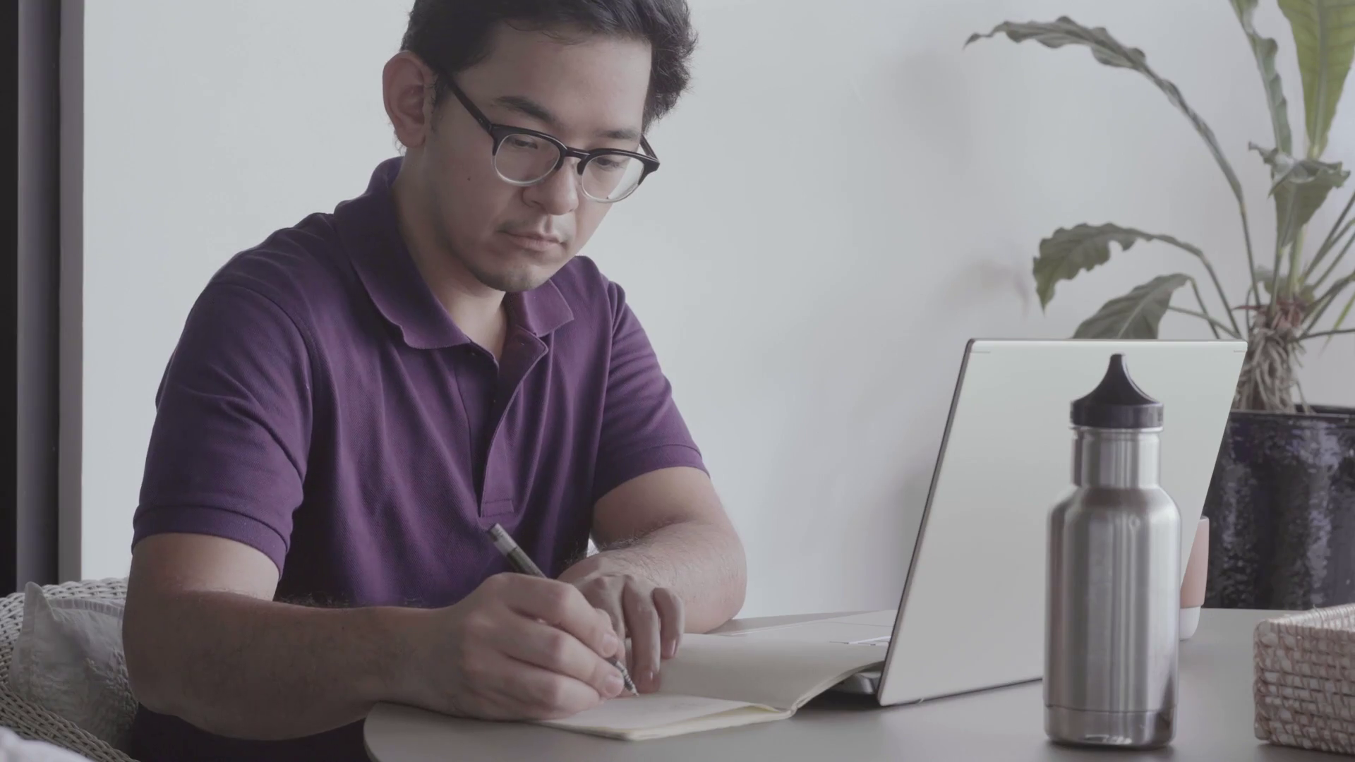 Calm Filipino man writing then typing at home ourdoors at veranda Stock ...