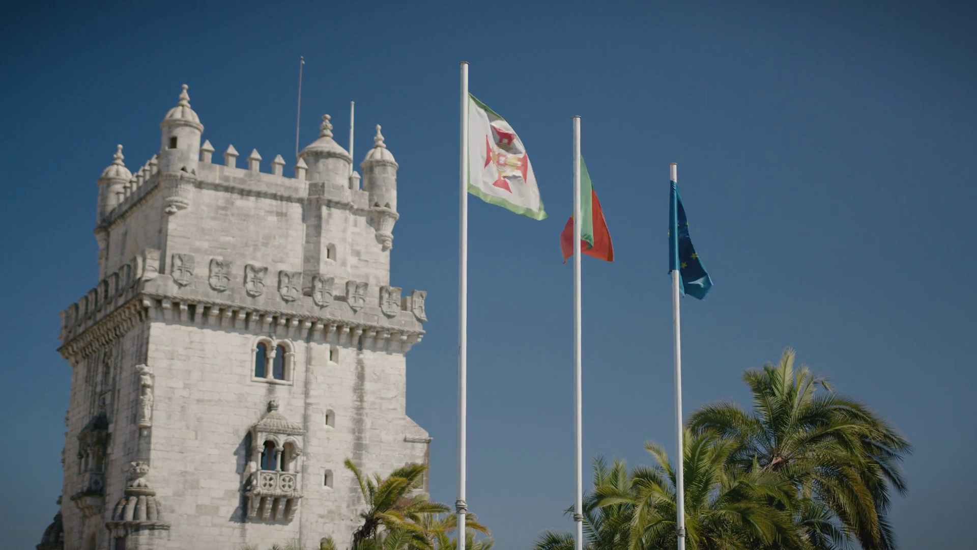 Tower Of Belem Park With 3 Flags Blowing In Stock Footage SBV-347772639 ...