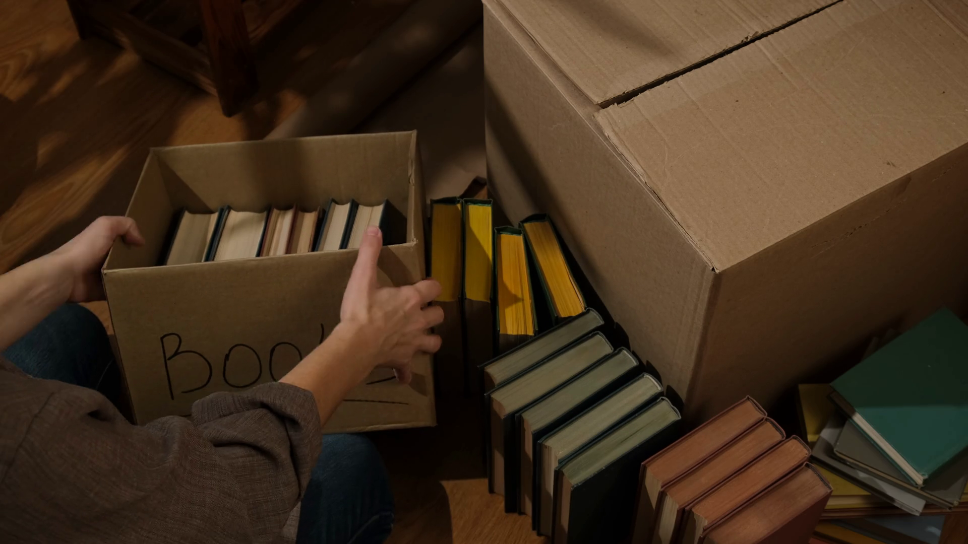 Preparing Move Woman Packs Books Into Moving Stock Footage SBV ...