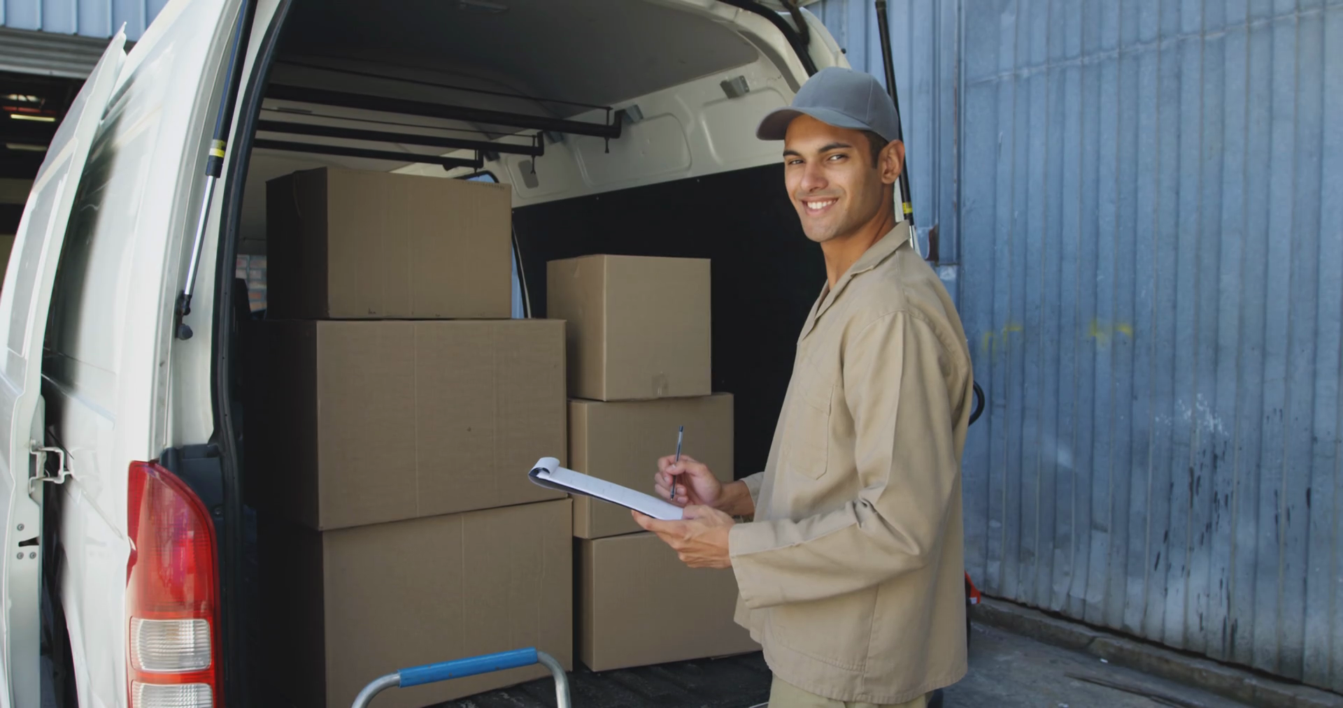 Portrait of a male van driver with a warehouse delivery Stock Video ...