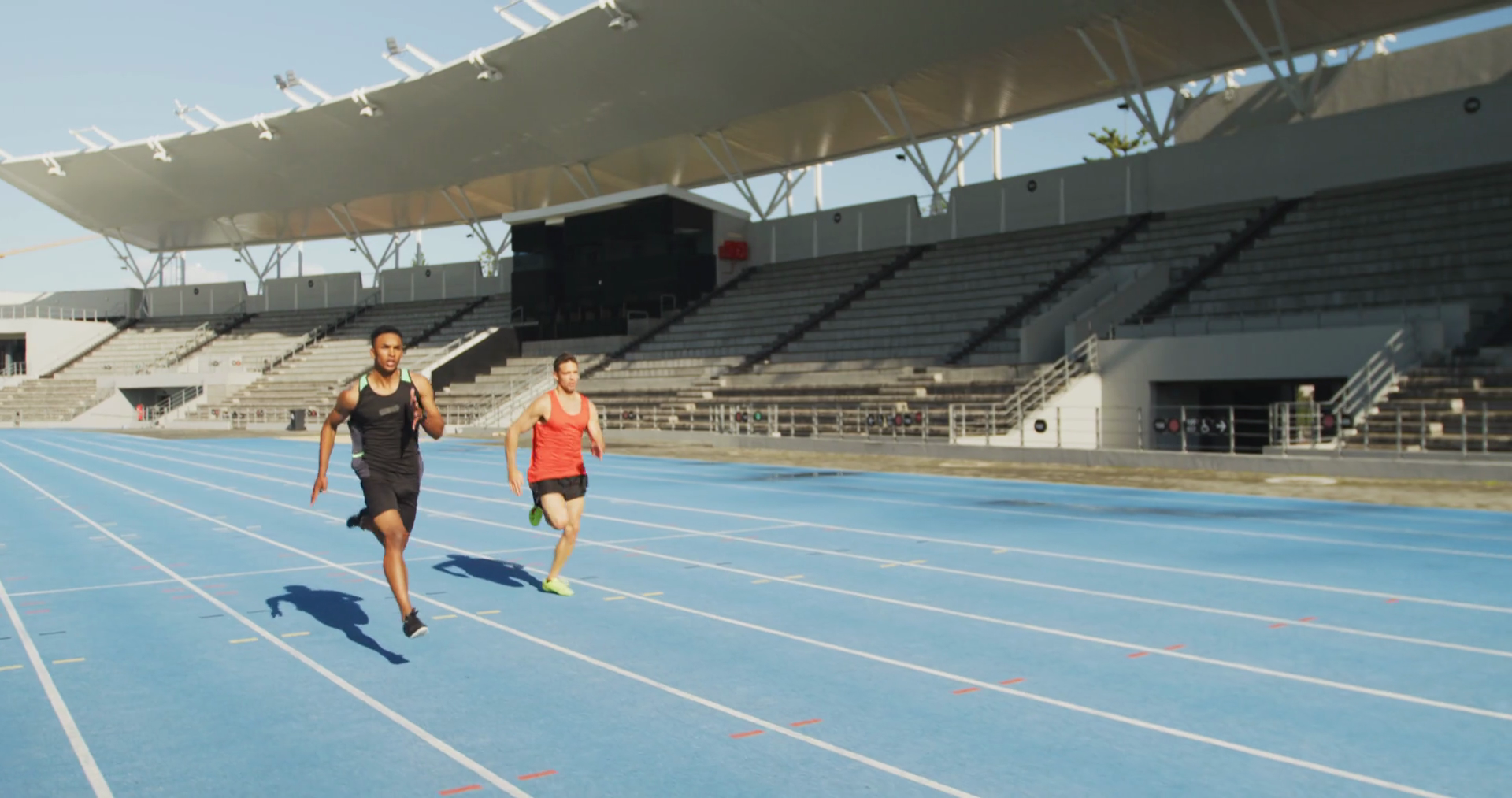 Two Athletes Running In Stadium Stock Footage SBV-346590739 - Storyblocks