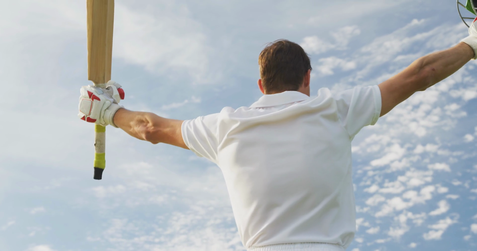 Low angle view cricket raising his hands with the bat Stock Video ...