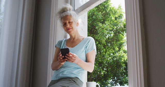 Woman Reading Smartphone Stock Footage: Royalty-Free Video Clips ...