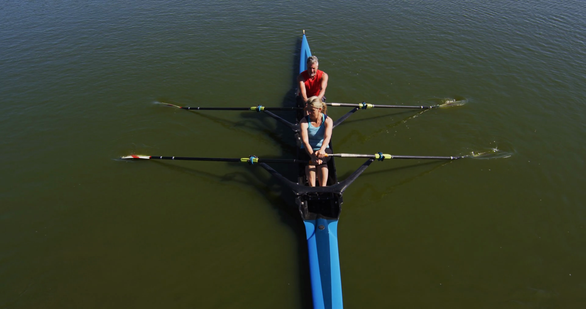 Senior caucasian man and woman rowing boat on a river Stock Video ...