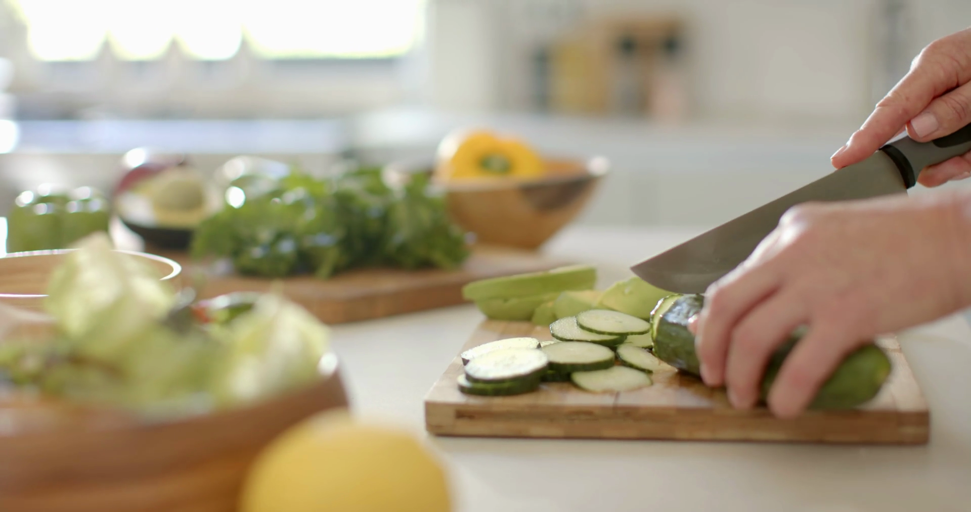 Caucasian Woman Slicing Cucumber In Kitchen Stock Footage SBV-351972262 ...