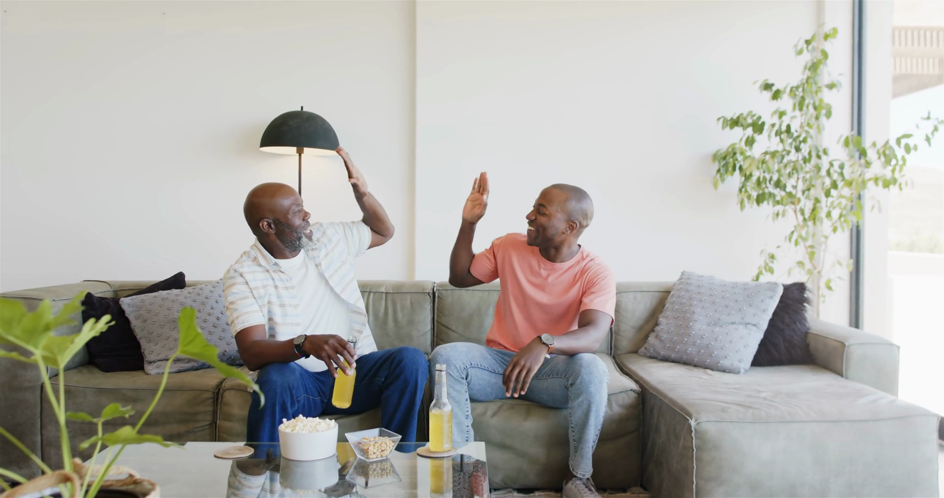 High-fiving Father Son Enjoying Drinks Stock Footage SBV-352121752 ...