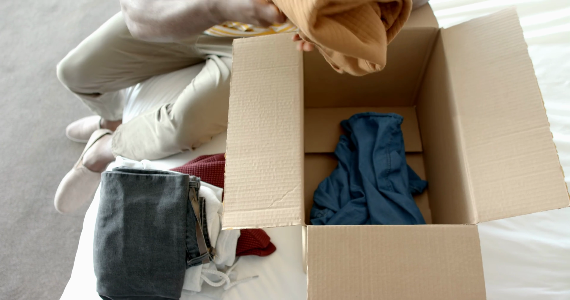 Packing Clothes Into Cardboard Box African Stock Footage SBV-352102714 ...