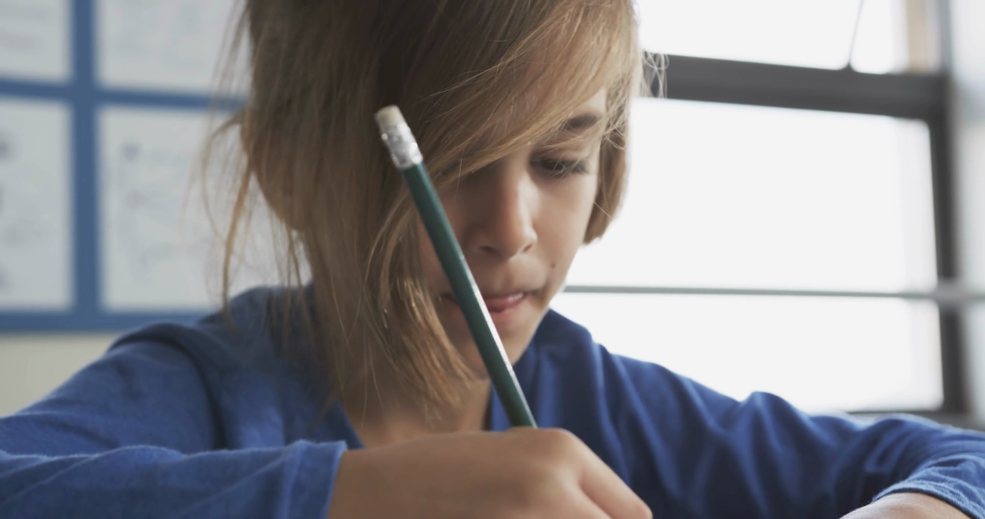 In School Child Concentrating On Writing Stock Footage SBV-352069657 ...