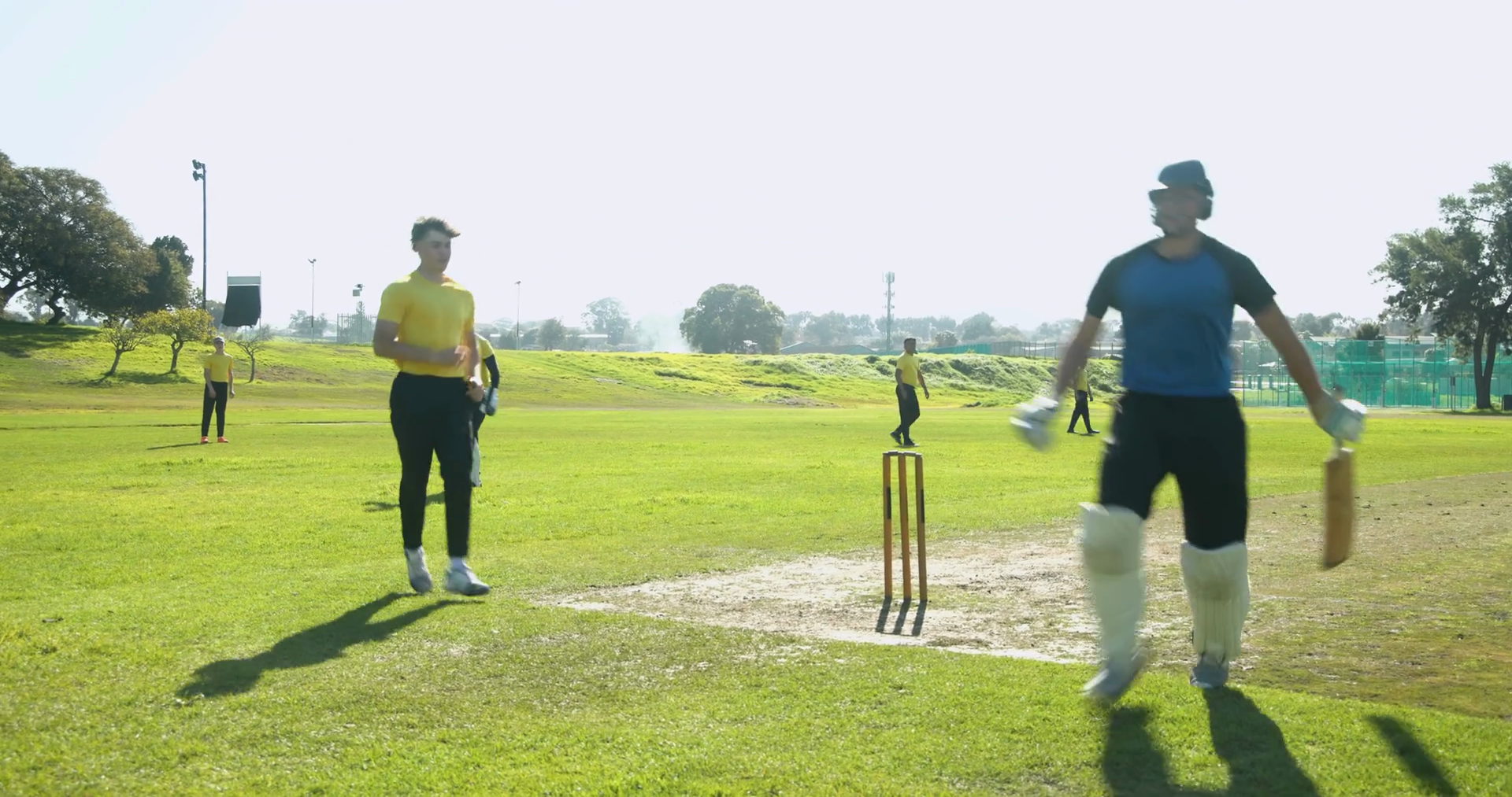 Cricket Players In Yellow Jerseys Practicing Stock Footage SBV ...
