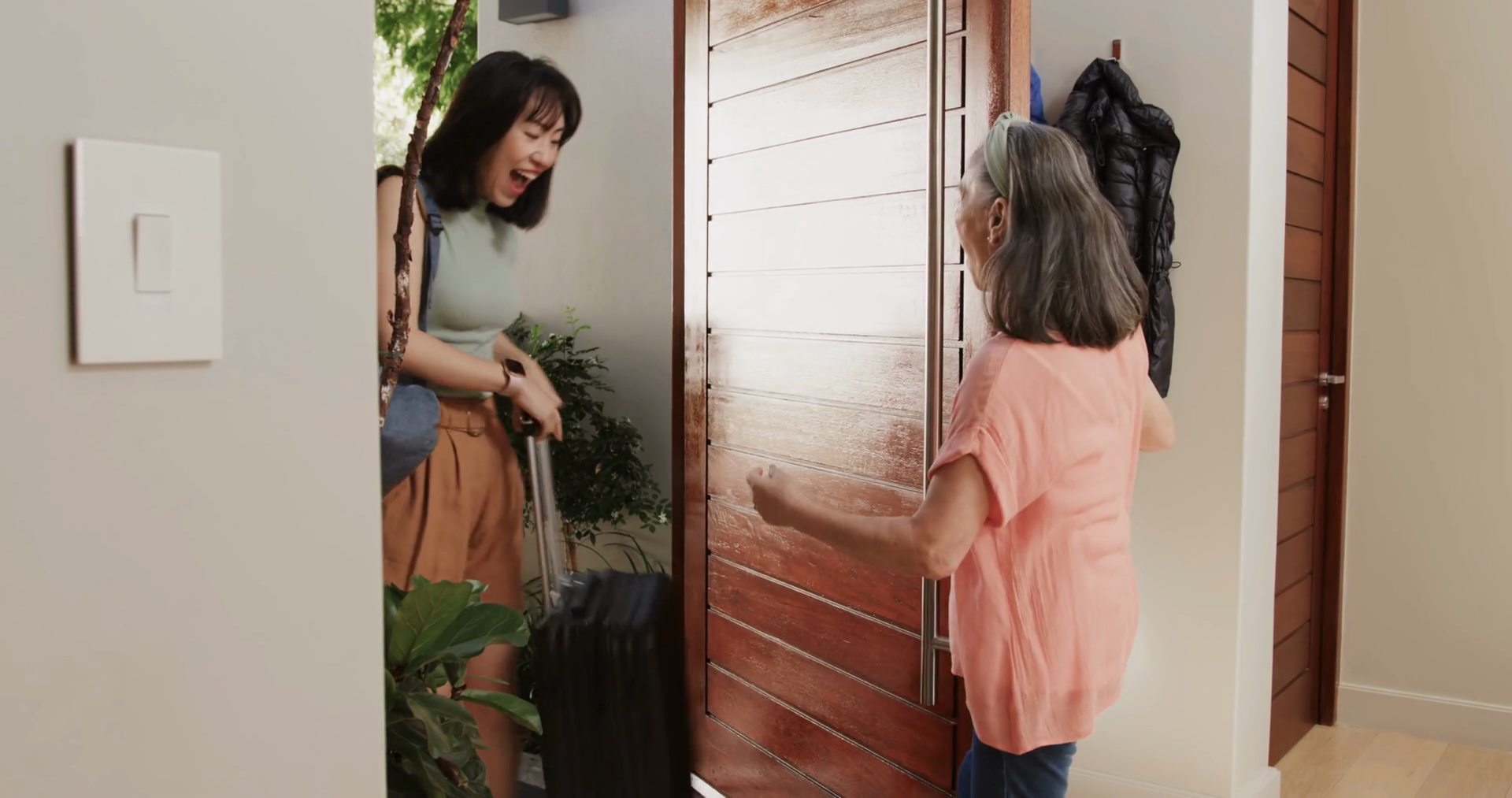 Senior Chinese Mother Unlatching Door Stock Footage SBV-352272538 ...