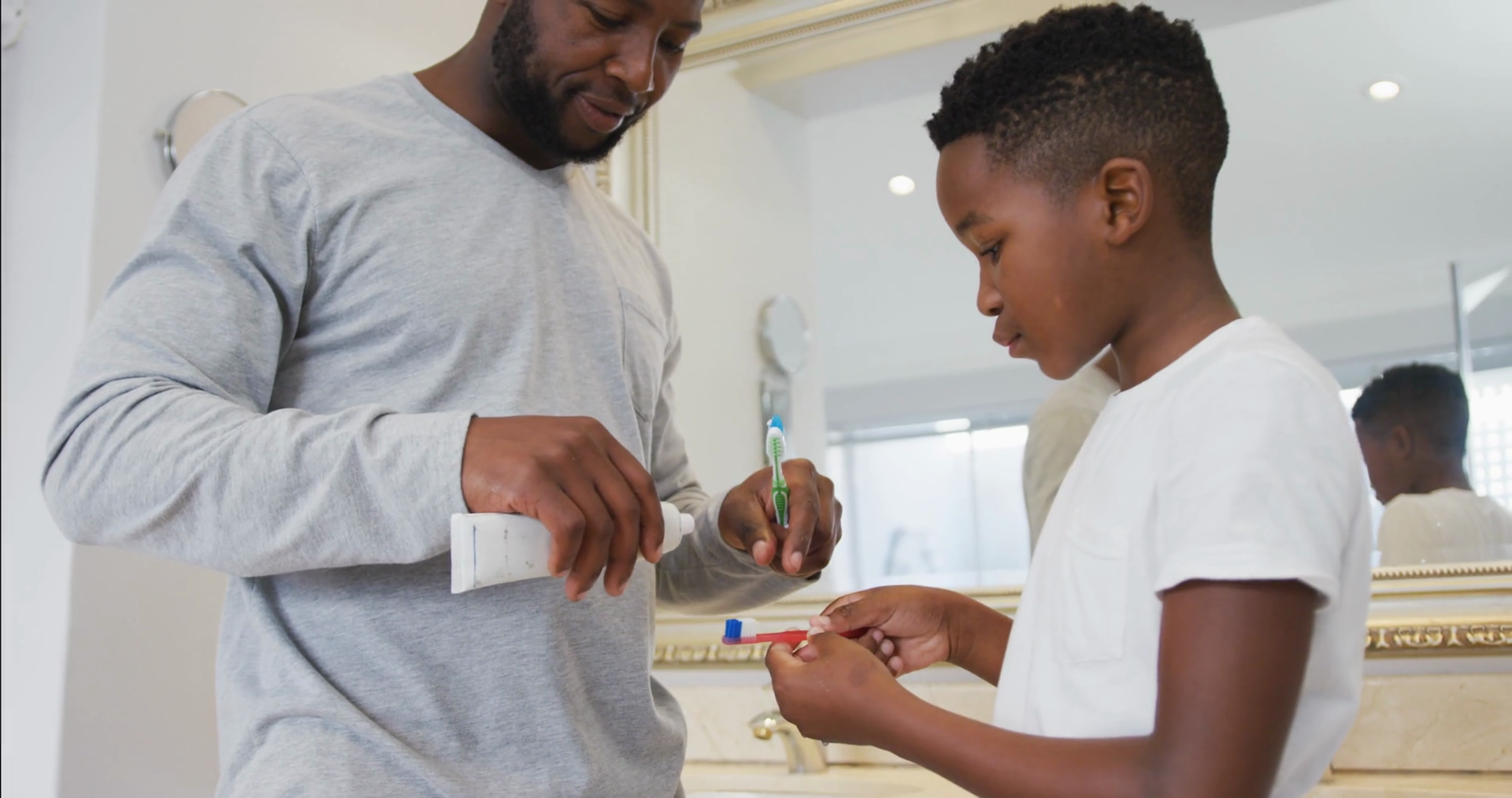 African American Dad Putting Toothpaste On Stock Footage SBV-348474115 ...
