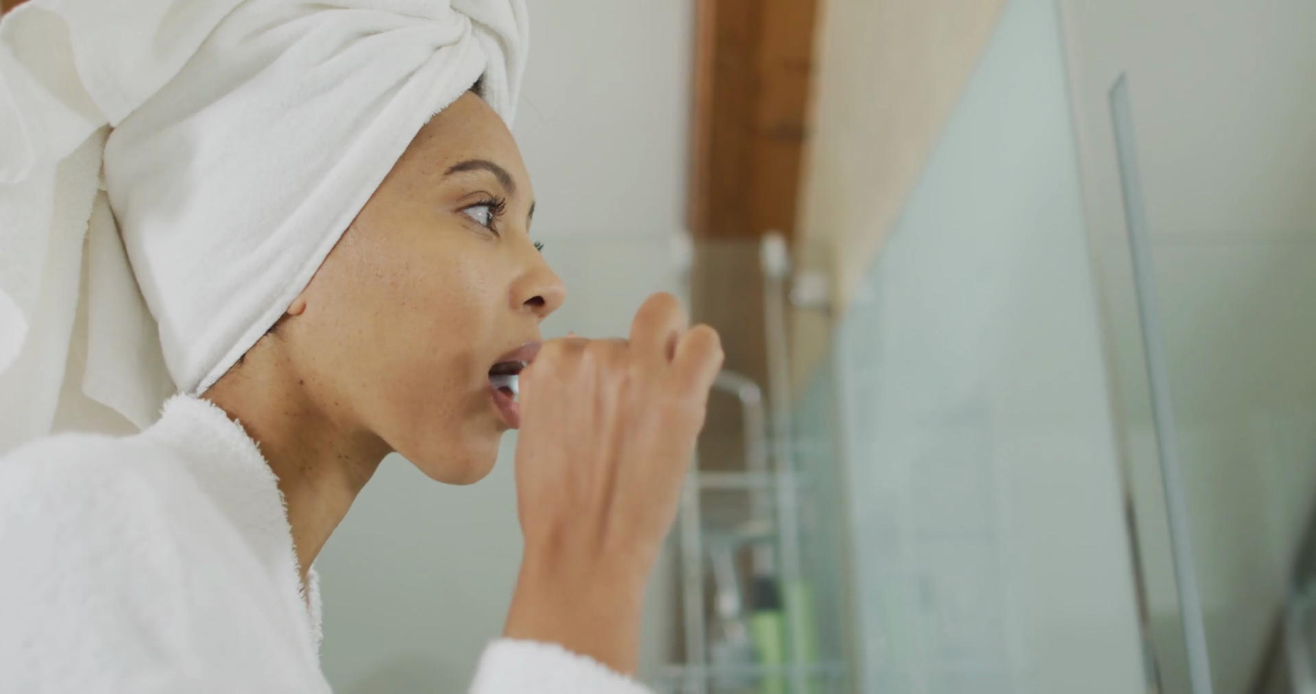 Mixed Race Woman Looking At Mirror Brushing Stock Footage SBV-348434455 ...