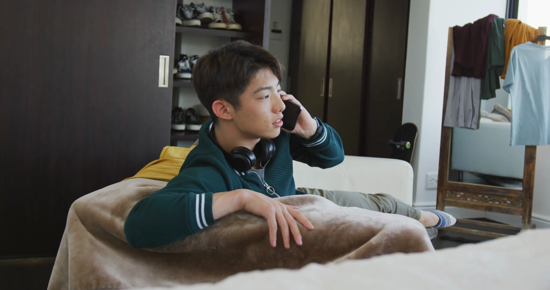 Asian Boy Talking On Smartphone Sitting On Stock Footage SBV-348607253 ...