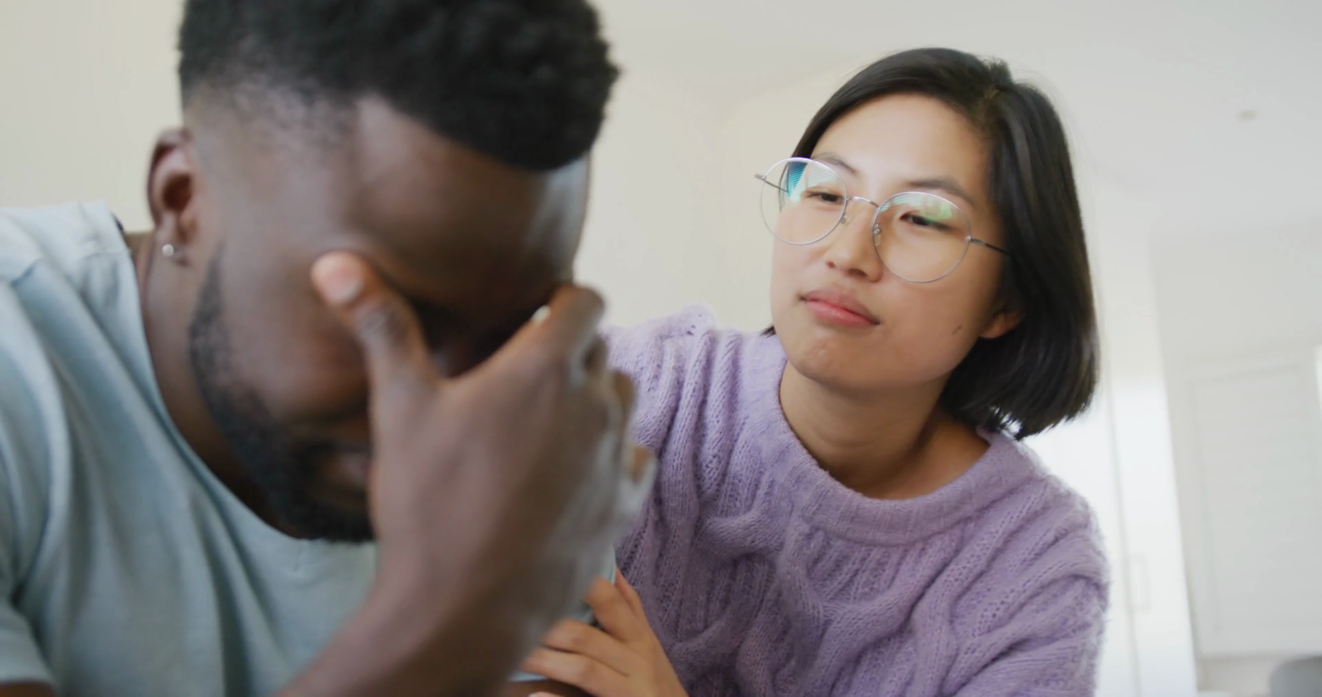 Sad Diverse Couple Sitting On Couch Talking Stock Footage SBV-348607617 ...