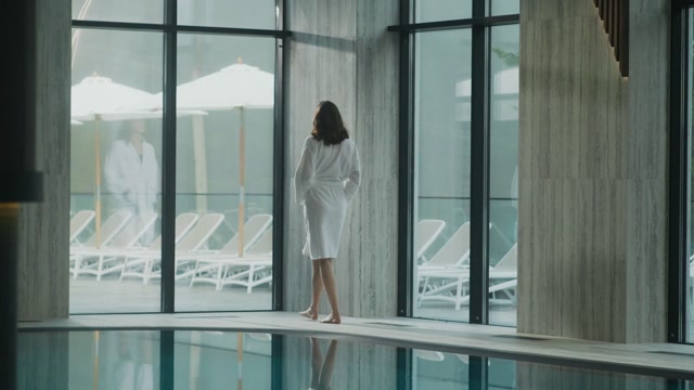 Woman Taking Off Robe In Pool Stock Footage: Royalty-Free Video Clips ...