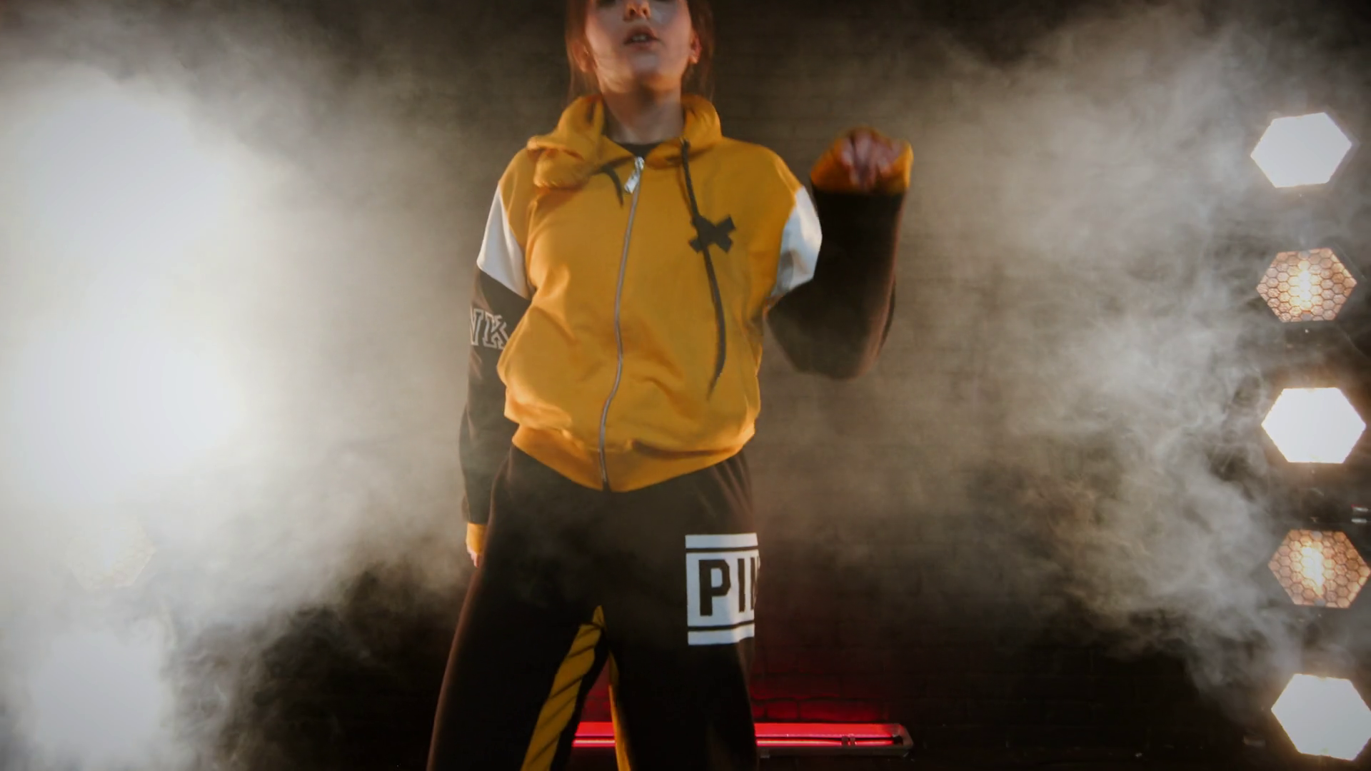 Young Brunette Dancing Break Dance In Studio. Flashing Light. Room Is ...