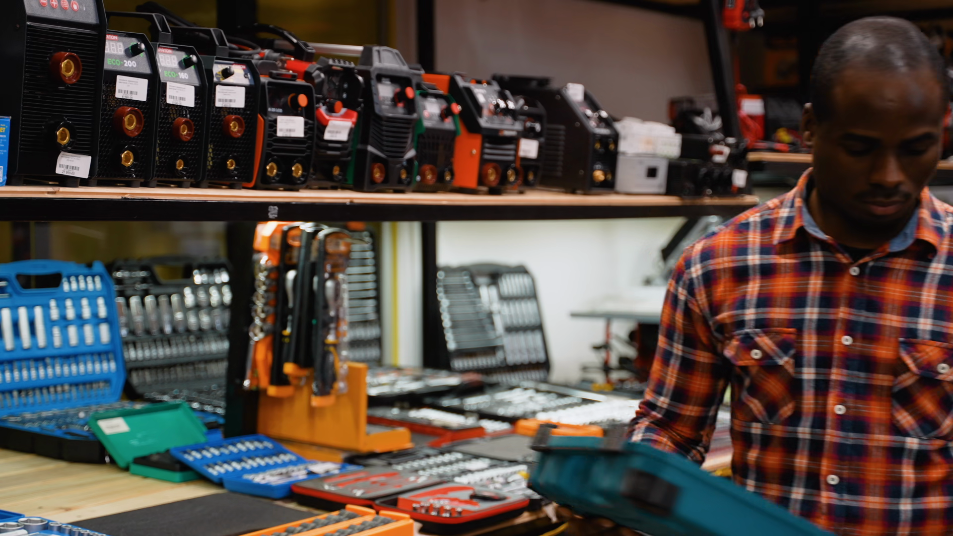 African Man Examining Comprehensive Tool Set Stock Footage SBV ...
