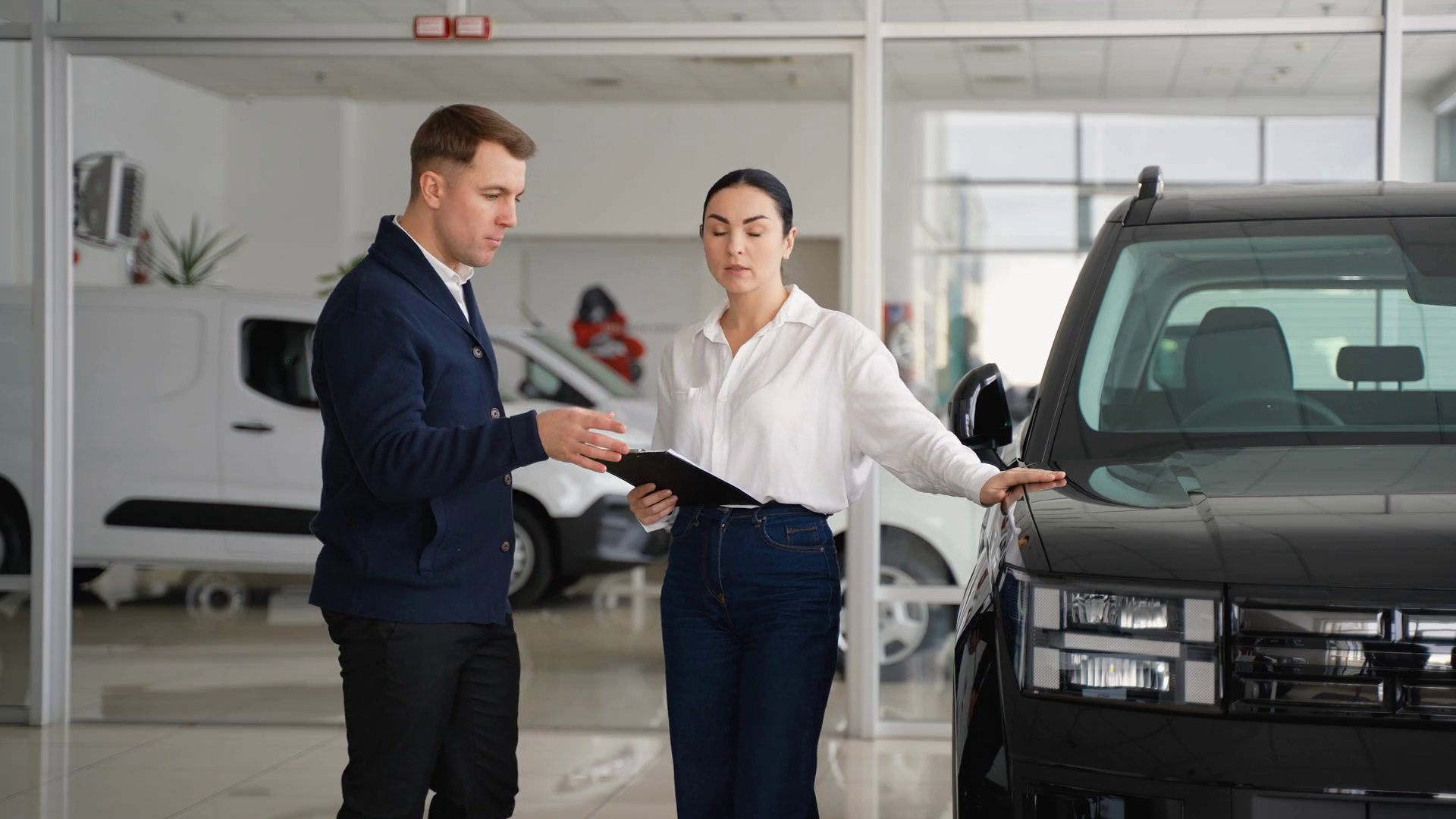 Car Saleswoman Explaining Right-hand Vehicle Stock Footage SBV ...
