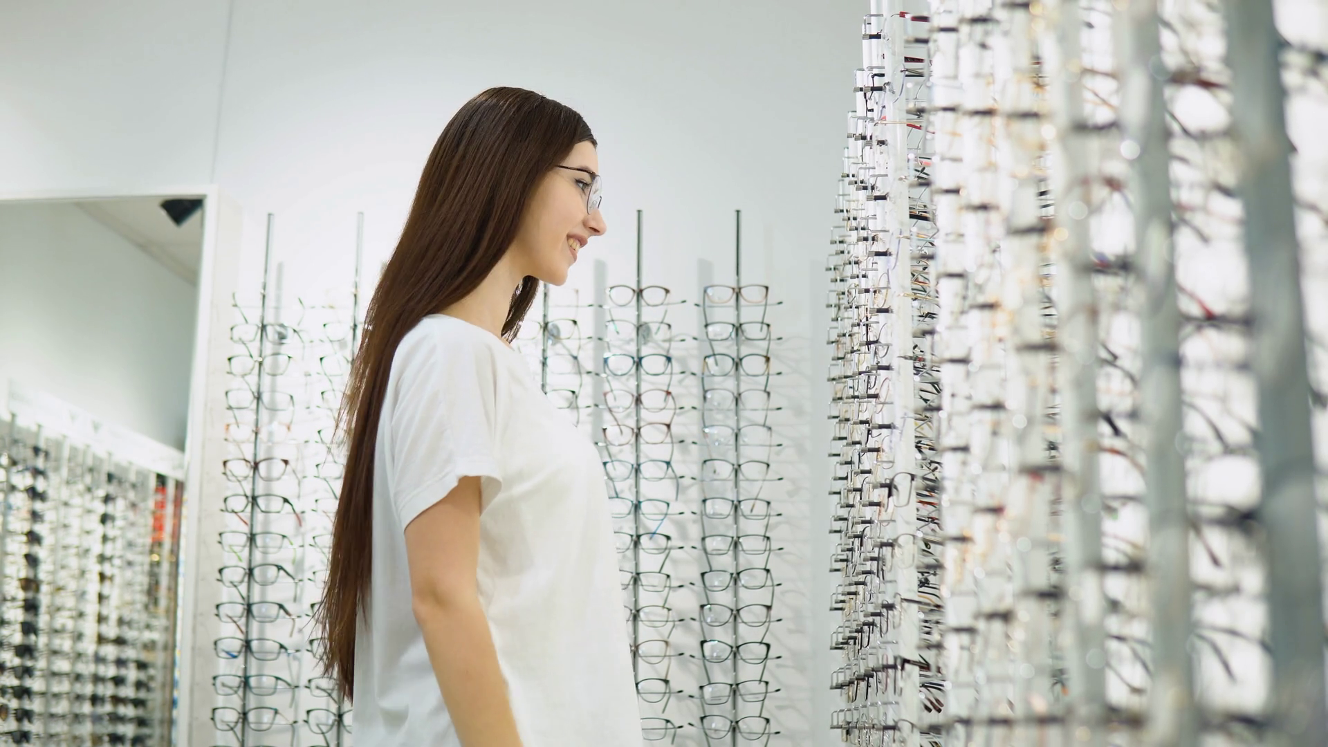 Woman Chooses Spectacles Row Of Glasses In Stock Footage SBV-352675788 ...