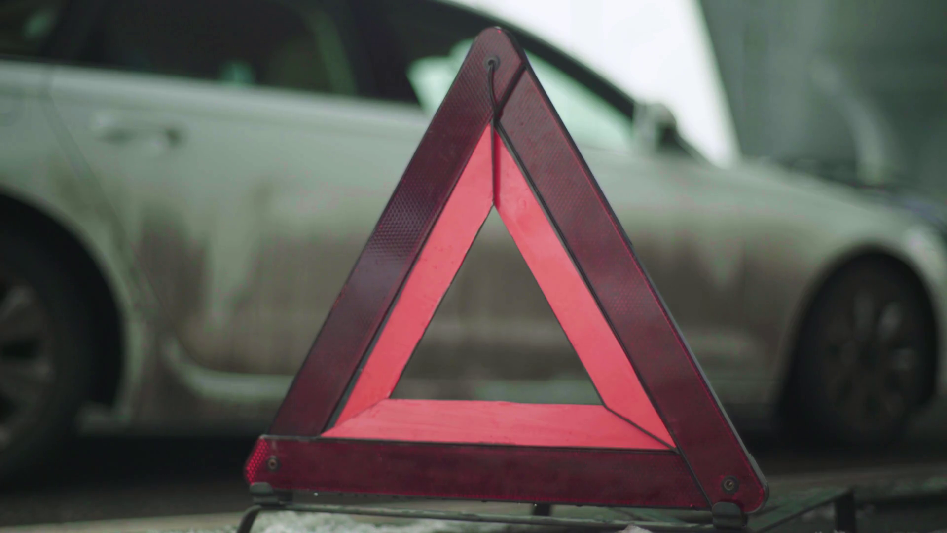 Warning sign "Red Triangle" on the road. Close-up. Crash. Car breakdown ...