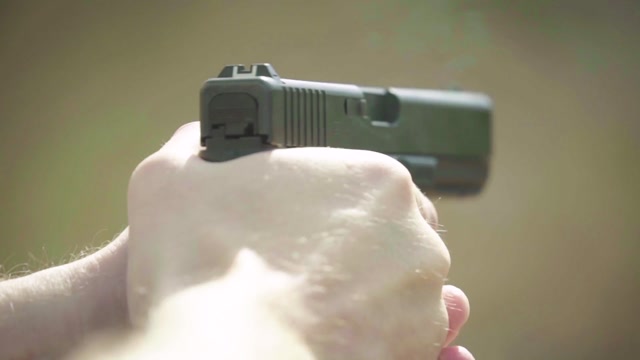 Woman Shooting A Gun In A Shooting Gallery Slow Motion Stock Footage ...