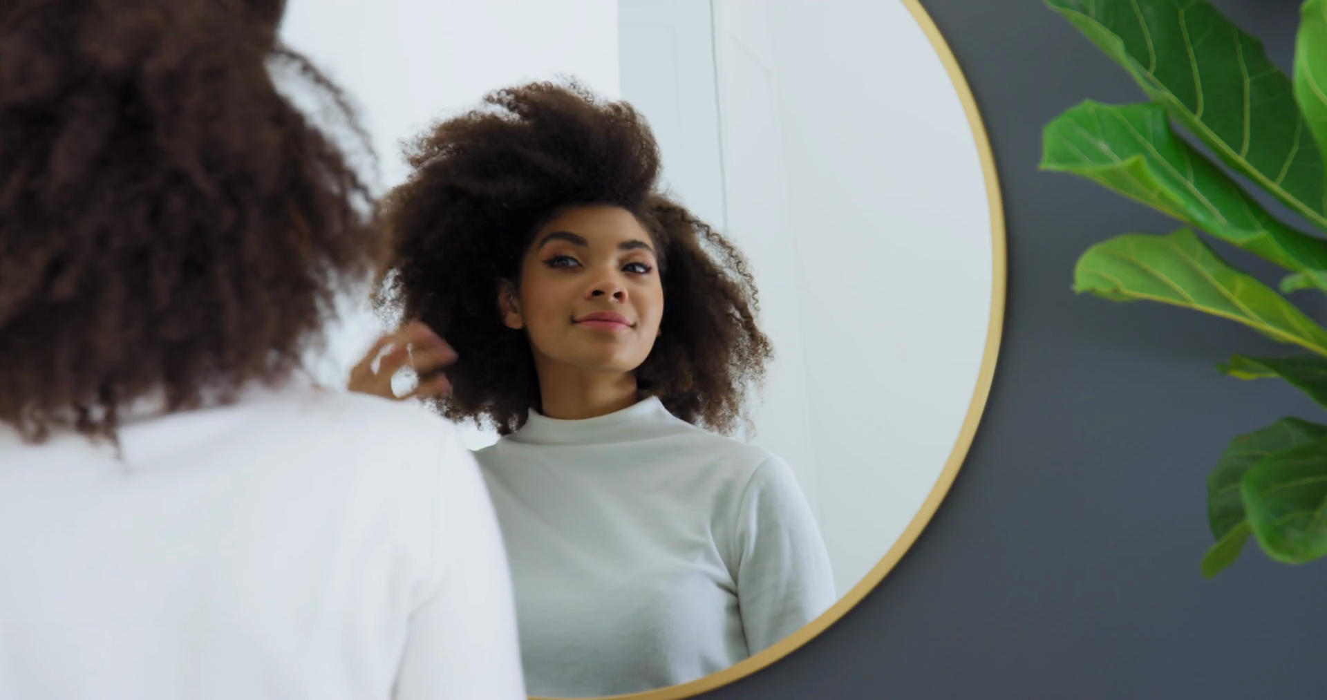 Young Woman Fixing Hair In Mirror Claremont Stock Footage SBV-338311067 ...