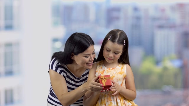 Daughter Giving Gift To Mother Stock Footage: Royalty-Free Video Clips ...