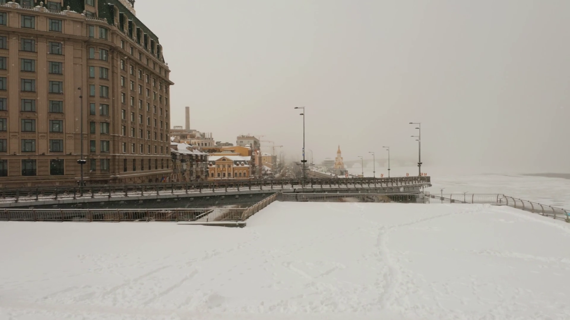 Panoramic view of Kyiv city Podol while snowfall. Winter city scape ...