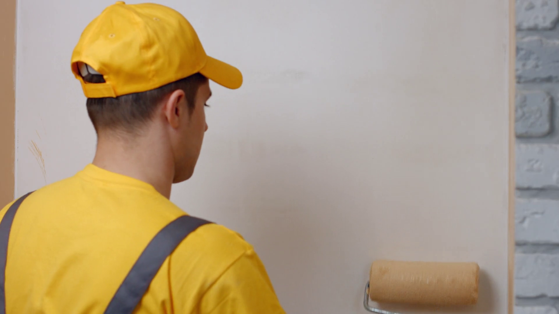 Builder Paints White Wall In Beige Color Stock Footage SBV-318309438 ...