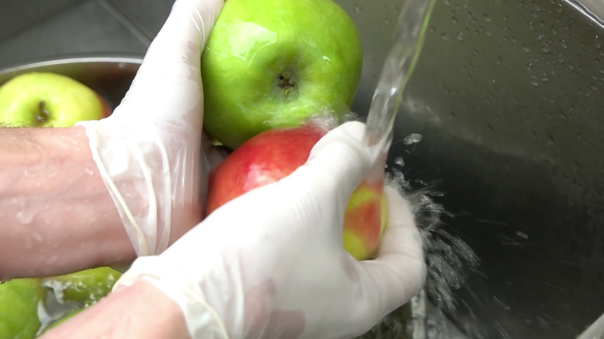 Close Up Hands Washing Two Apples Under Tap Stock Footage SBV-320352691 ...