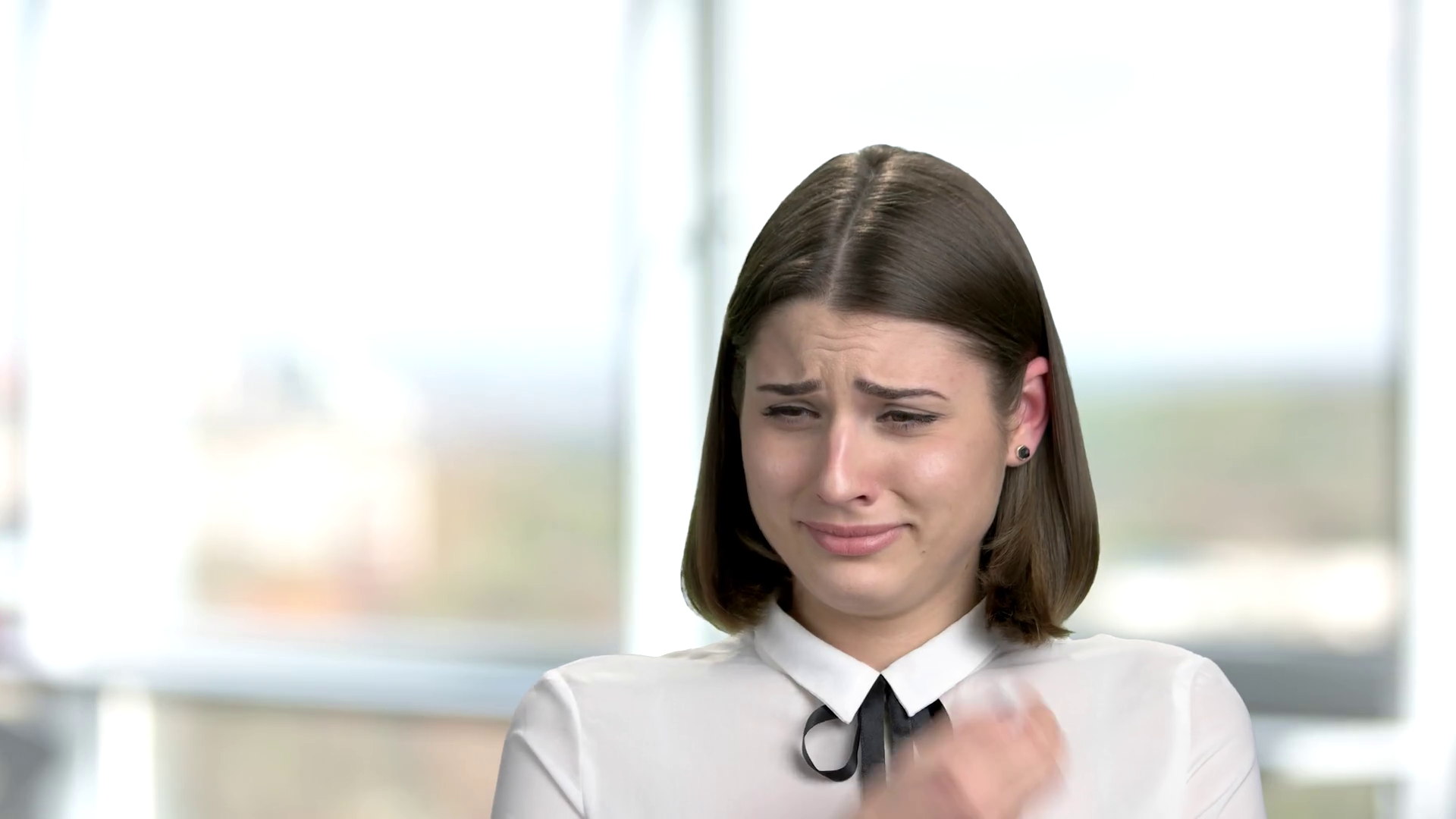 Close up young woman is crying. Portrait of crying woman wiping the ...