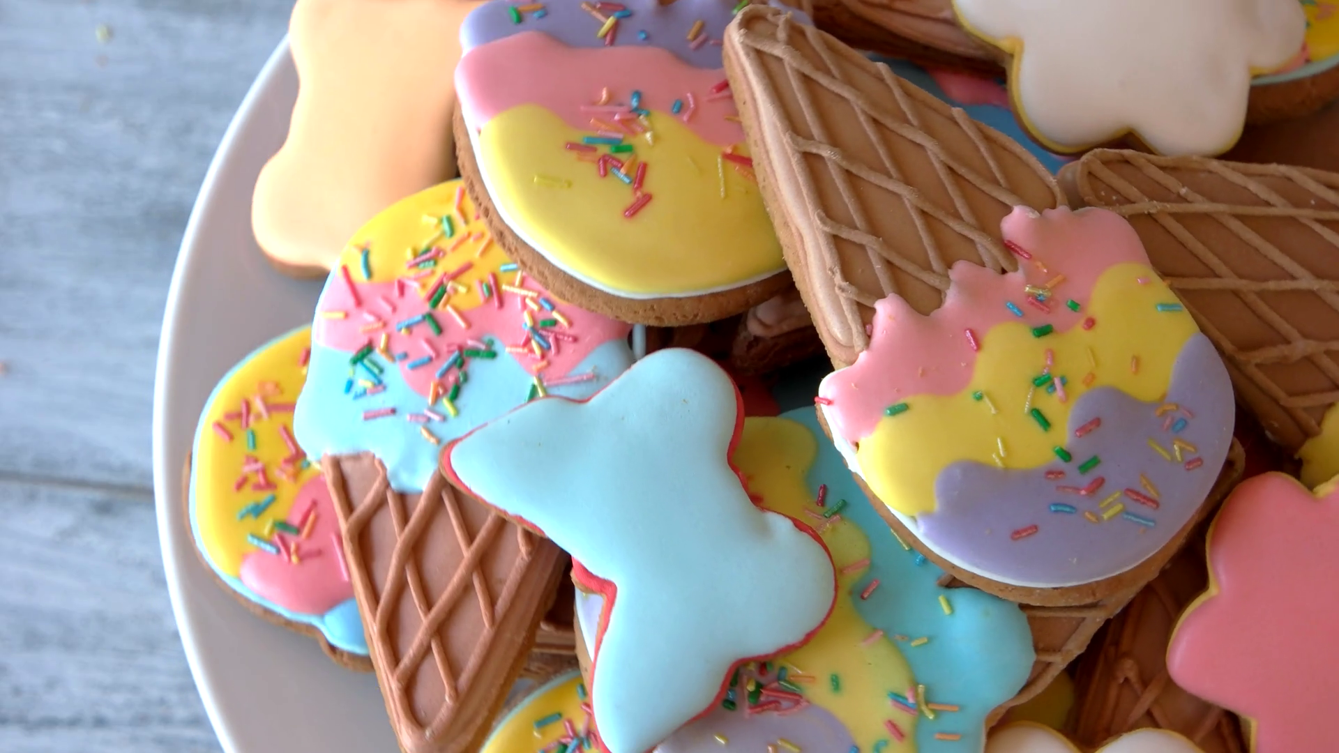 Colorful Biscuits With Frosting On Plate Stock Footage SBV-325624551 ...