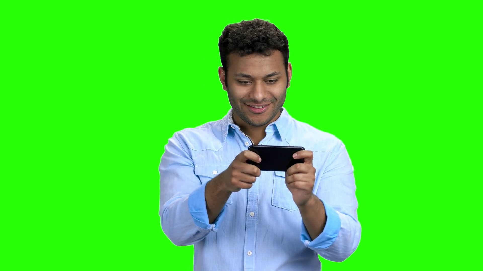 Excited business man plays game on his phone. Young Indian man enjoying ...